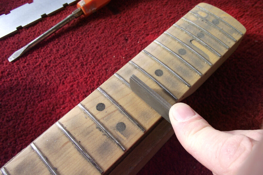 Dressing the frets on the maple neck – Manchester Guitar Tech